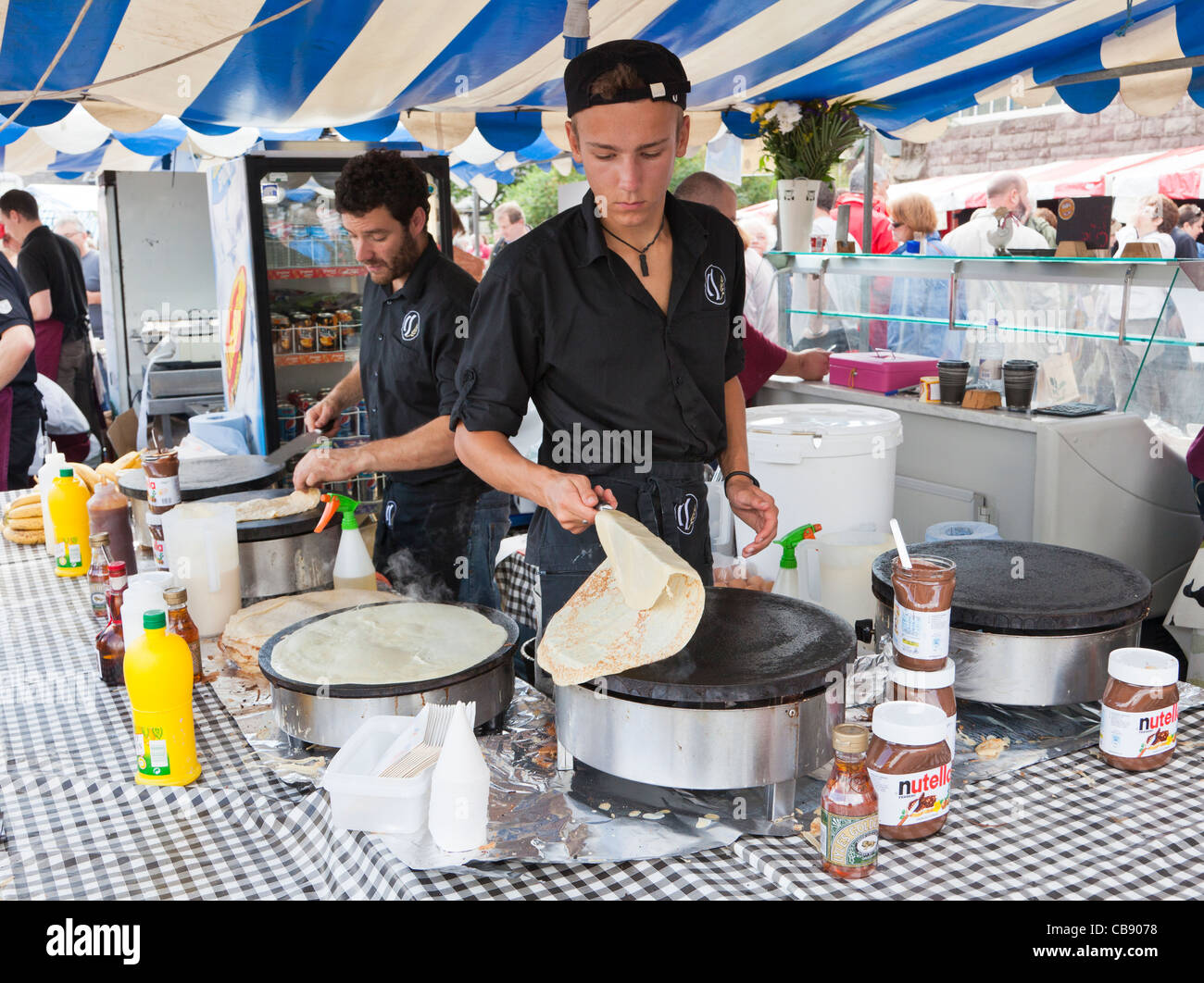 Cooking pancakes on a market stall Abergavenny Food Festival Wales UK ...