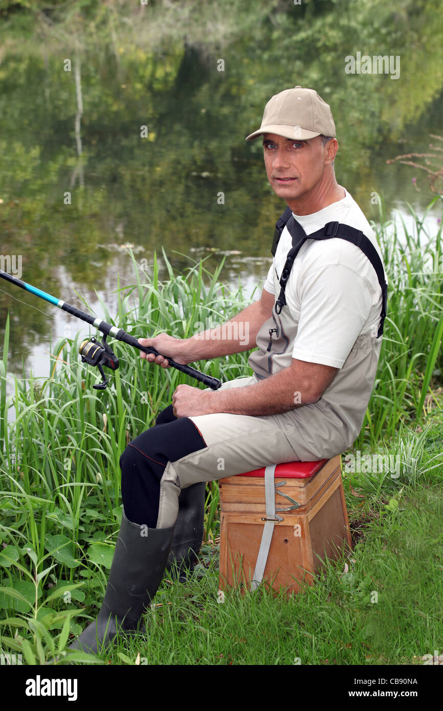 portrait of a man fishing Stock Photo - Alamy