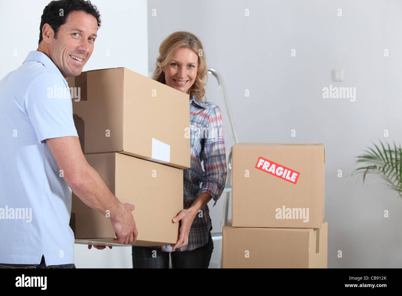 portrait of a couple moving Stock Photo - Alamy