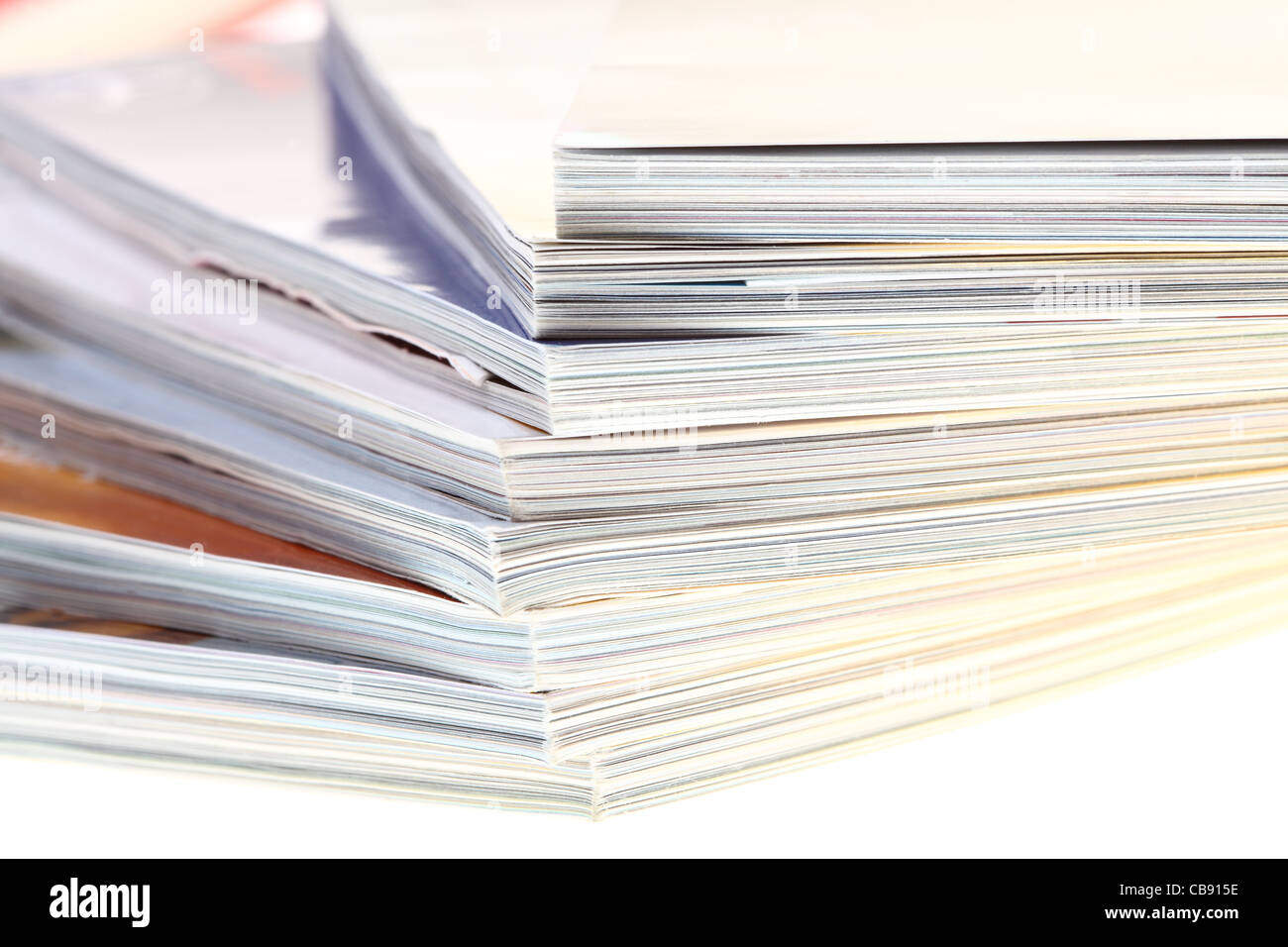 stack of magazines isolated over white background Stock Photo - Alamy