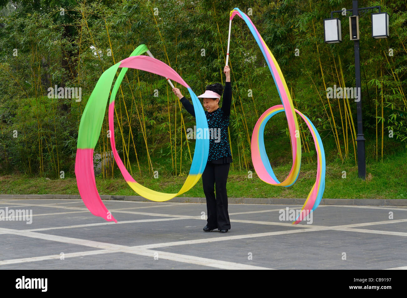 Ribbon streamer waving instructor at Zizhuyuan Purple Bamboo Park ...