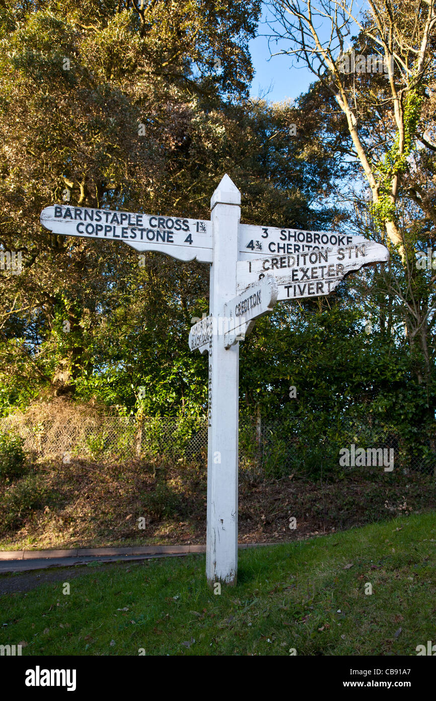Old direction sign in white and black near Crediton, Devon, England ...