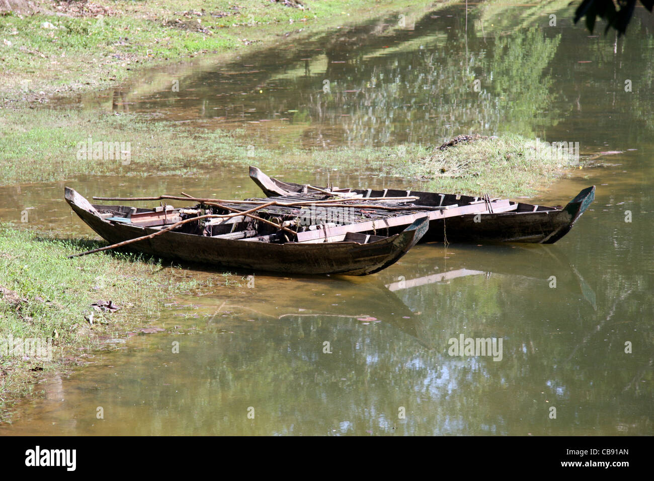 Traditional wood boats along the moat at Angkor Wat, Siem Reap ...