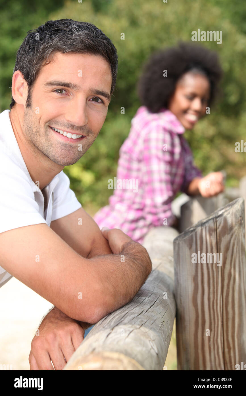 Man leaning against wooden fence hi-res stock photography and images ...