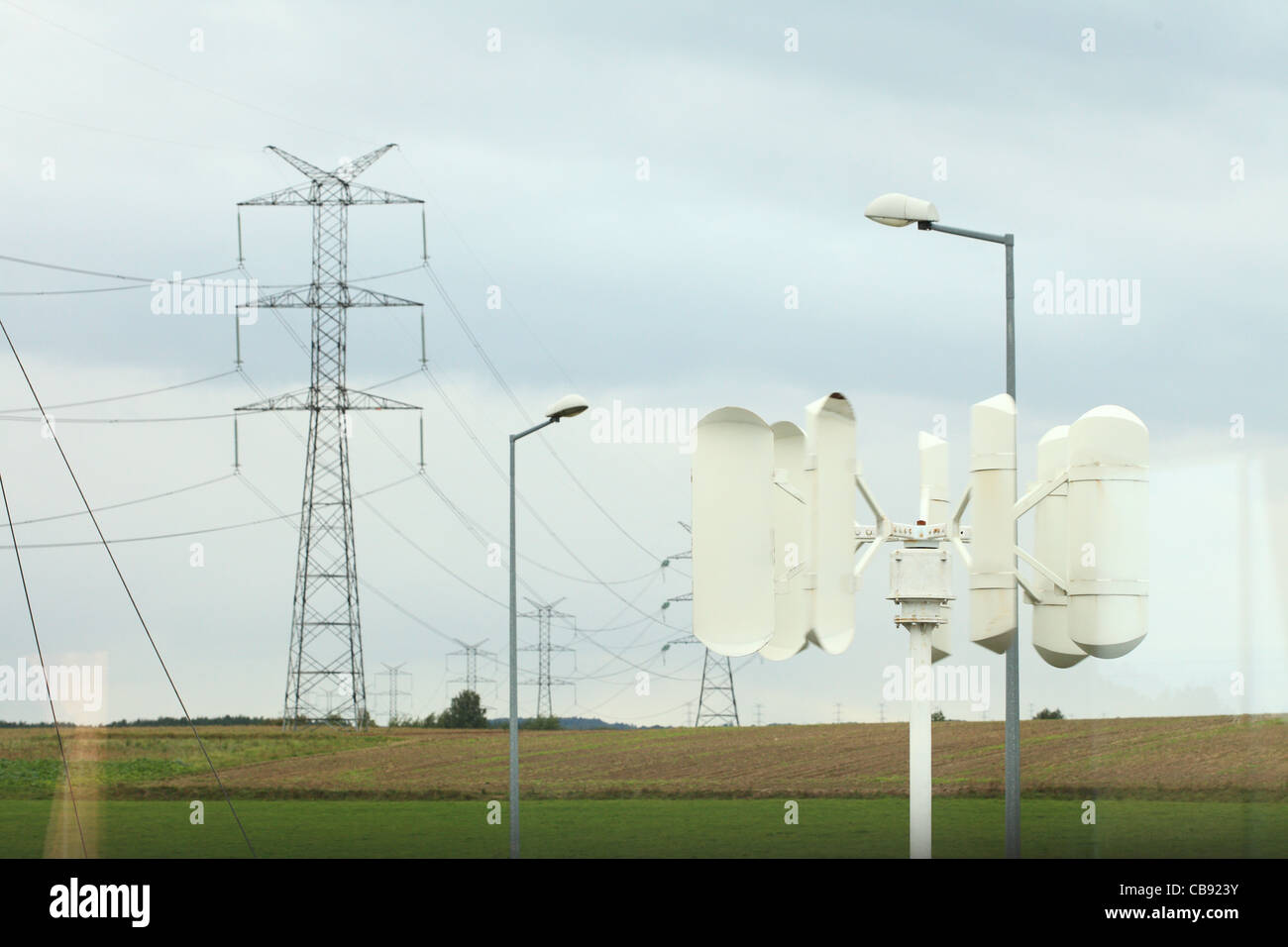 windmills for electric power production and electrical Stock Photo - Alamy