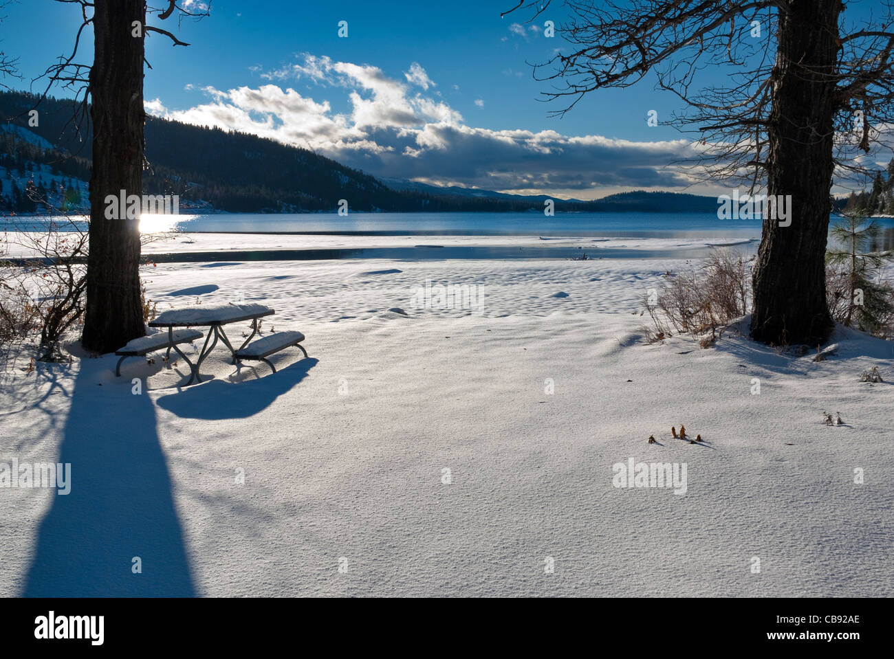 Picnic table covered with show in a picnic rest area Stock Photo - Alamy