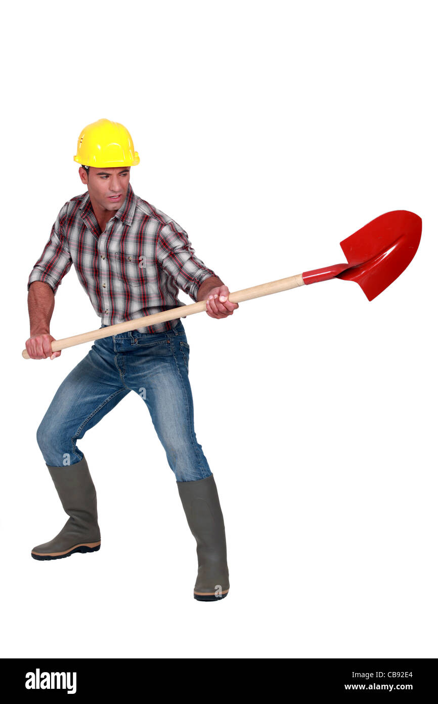 craftsman holding a shovel Stock Photo - Alamy