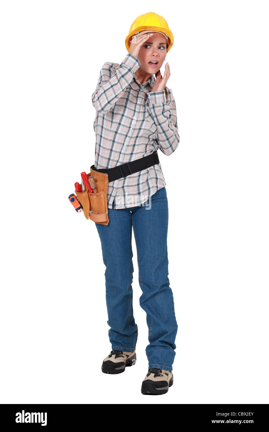 A scared female construction worker Stock Photo - Alamy
