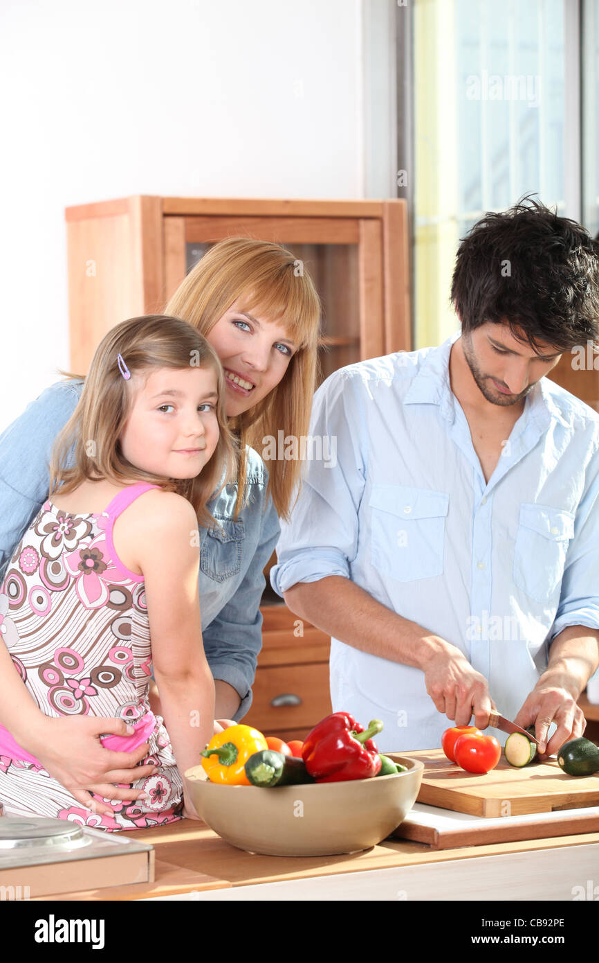 Family in their kitchen Stock Photo - Alamy