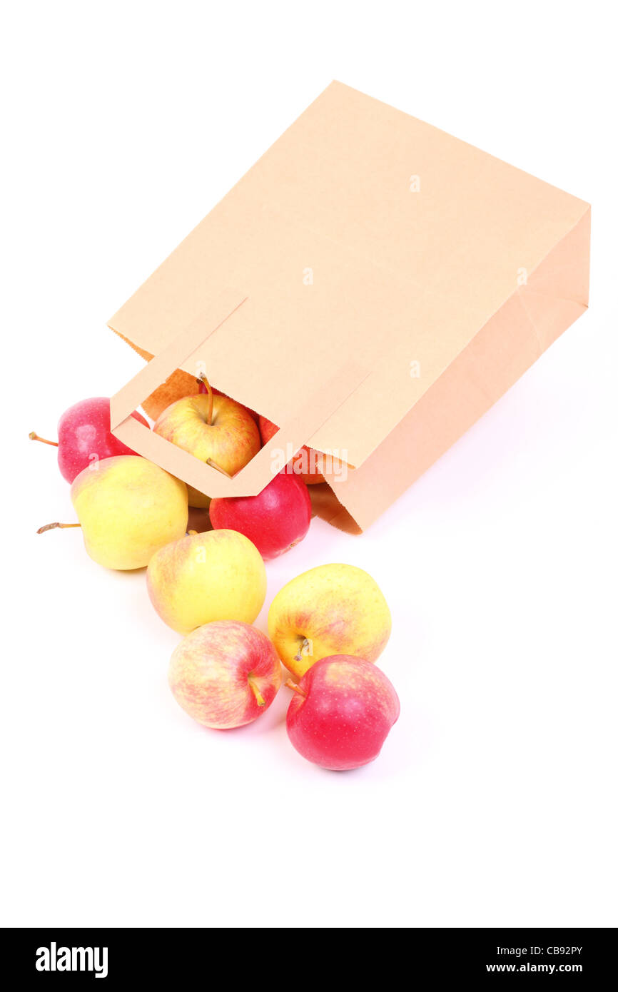 Shopping brown recycle gift bags and red apple isolated on white ...