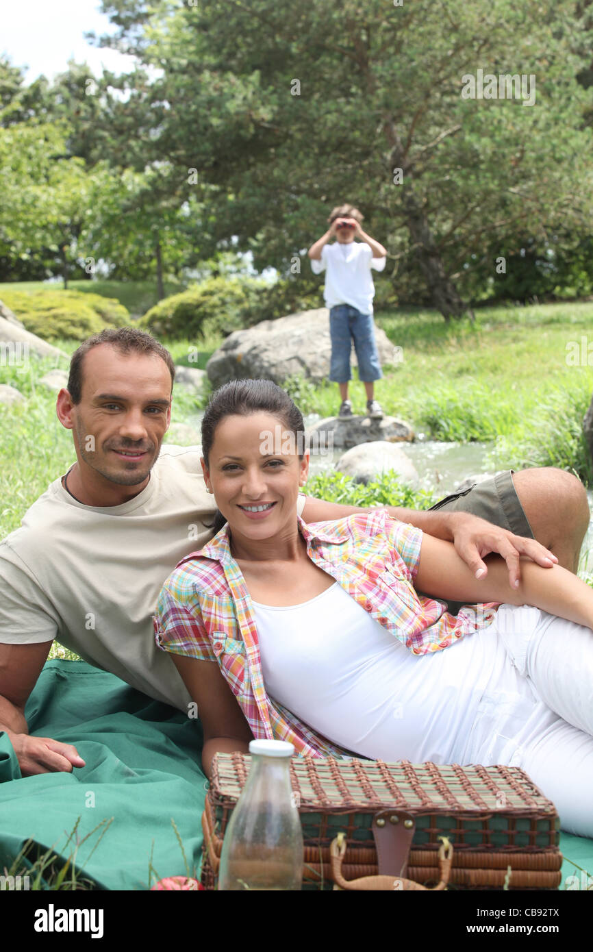 Family enjoying a picnic in the countryside Stock Photo - Alamy