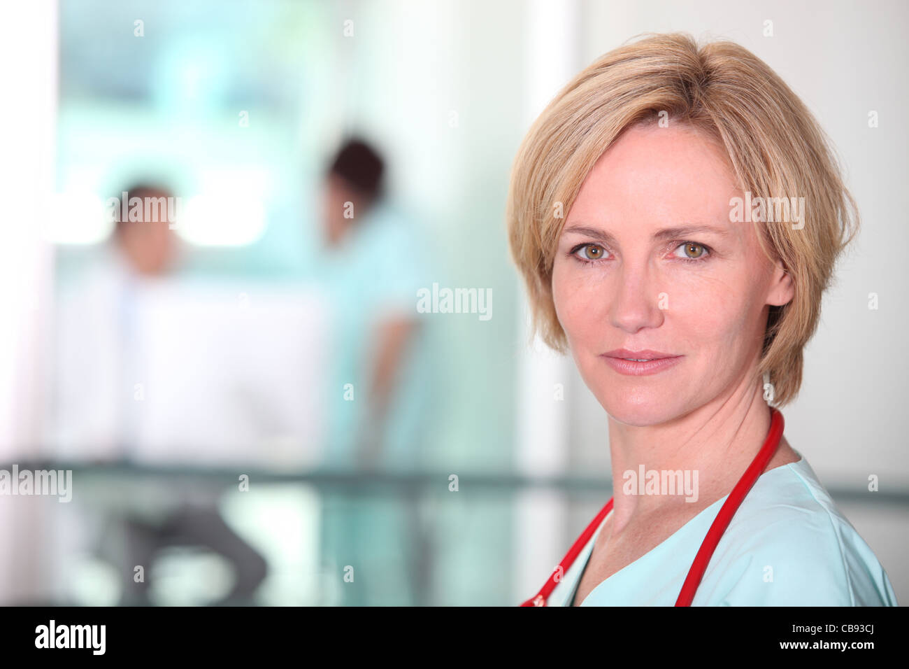 Blond female doctor Stock Photo - Alamy