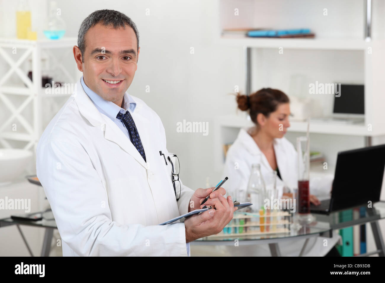 Two scientists working in laboratory Stock Photo - Alamy