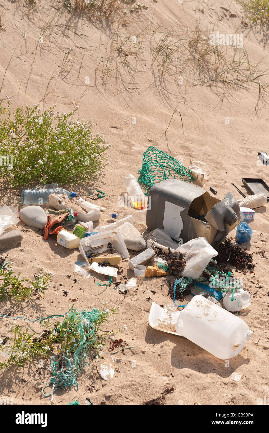 Human rubbish litters beech washed up fridge on isolated beech Stock ...