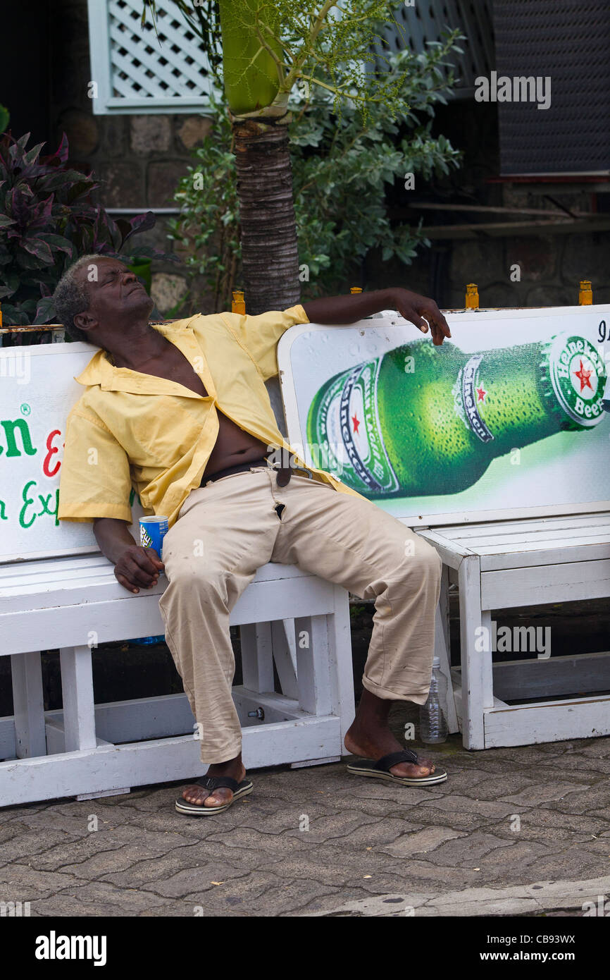 Asleep on bench Stock Photo - Alamy