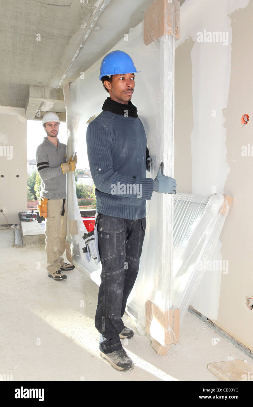 Two mason at work Stock Photo - Alamy