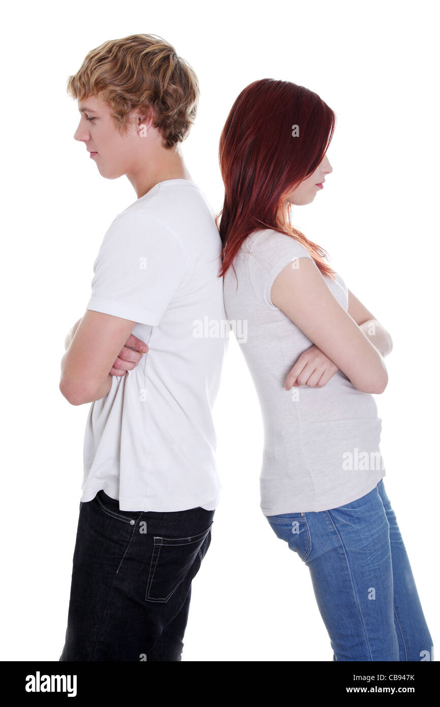 Angry couple standing back to back. Isolated on white background Stock ...