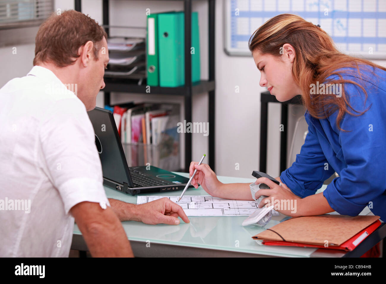 Tradespeople discussing a project Stock Photo - Alamy
