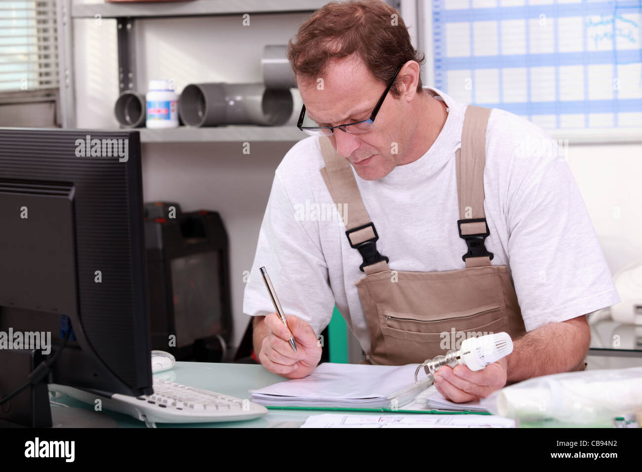 Man checking inventory Stock Photo - Alamy