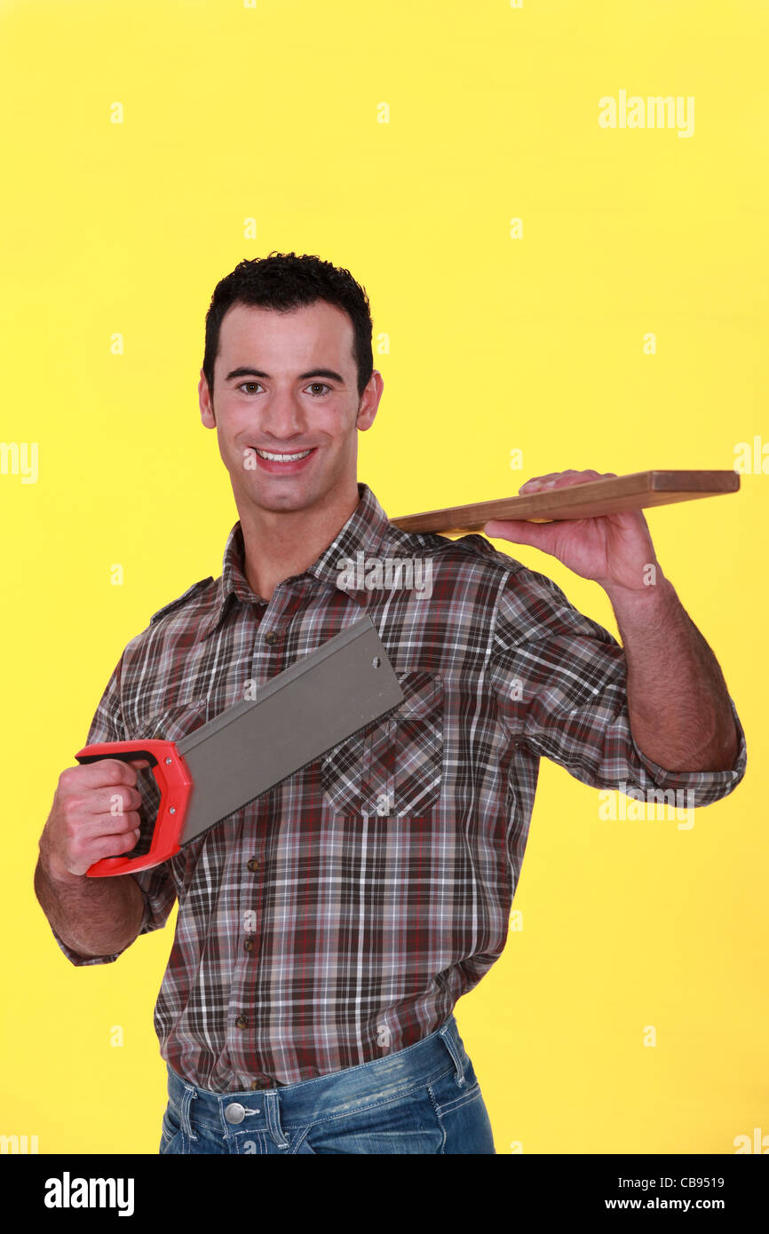 Carpenter carrying saw hi-res stock photography and images - Alamy