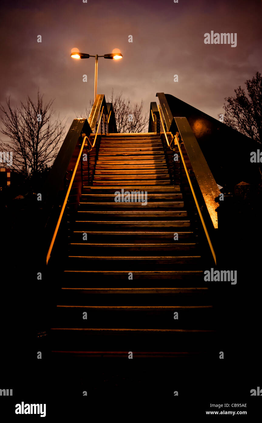 Railway footbridge at Bosham station in the evening with lamps Stock ...