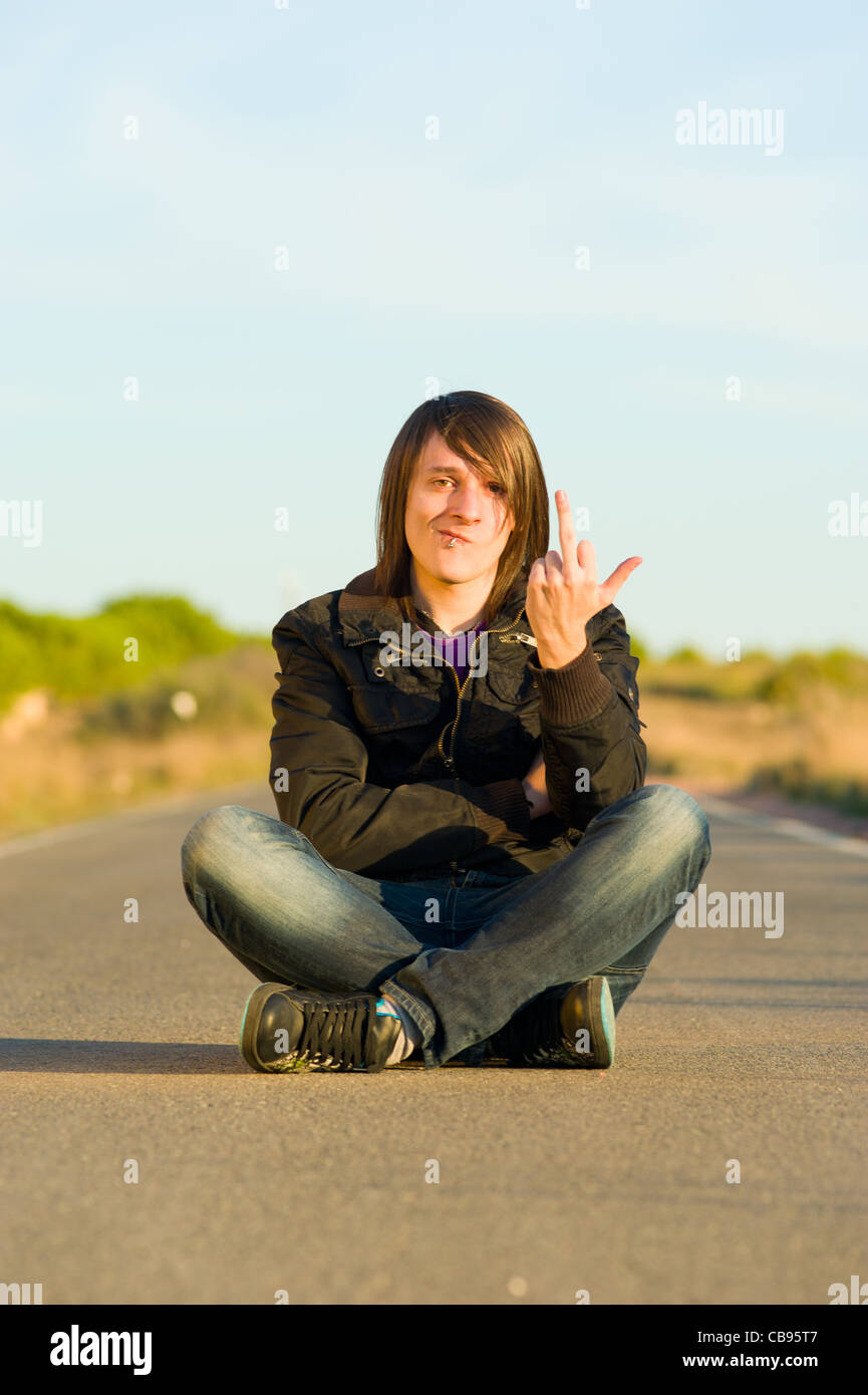 Young male demonstrating and showing his displeasure Stock Photo - Alamy