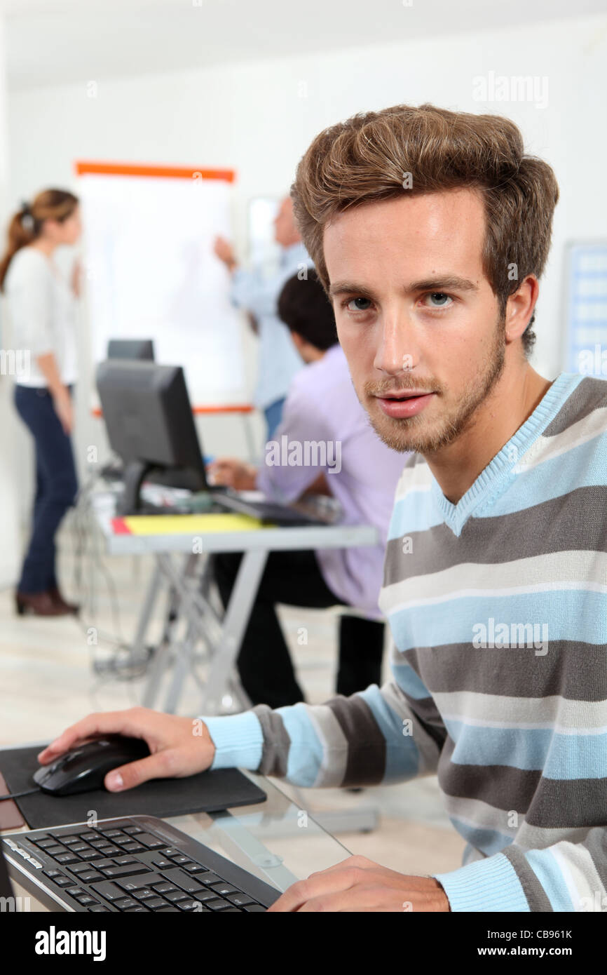 Young man in classroom Stock Photo - Alamy