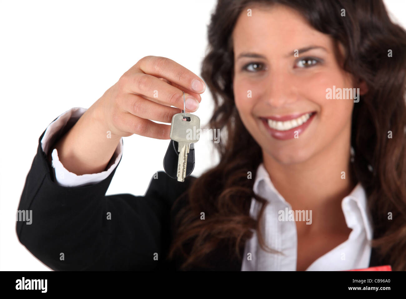 Female estate-agent handing over keys Stock Photo - Alamy