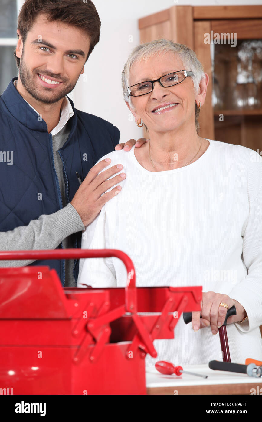 Senior with handyman Stock Photo - Alamy