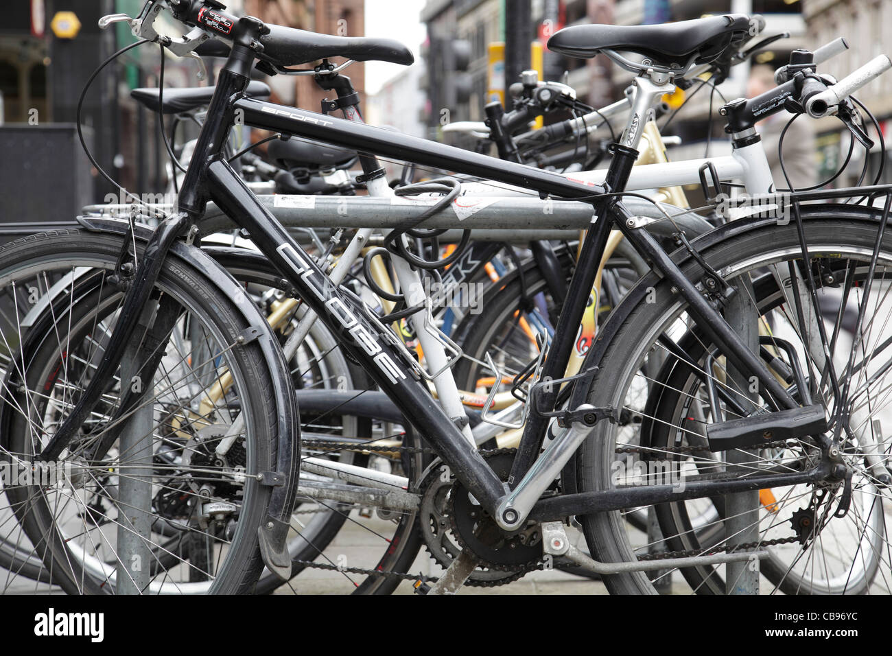 Cycles parked in a rack hi-res stock photography and images - Alamy
