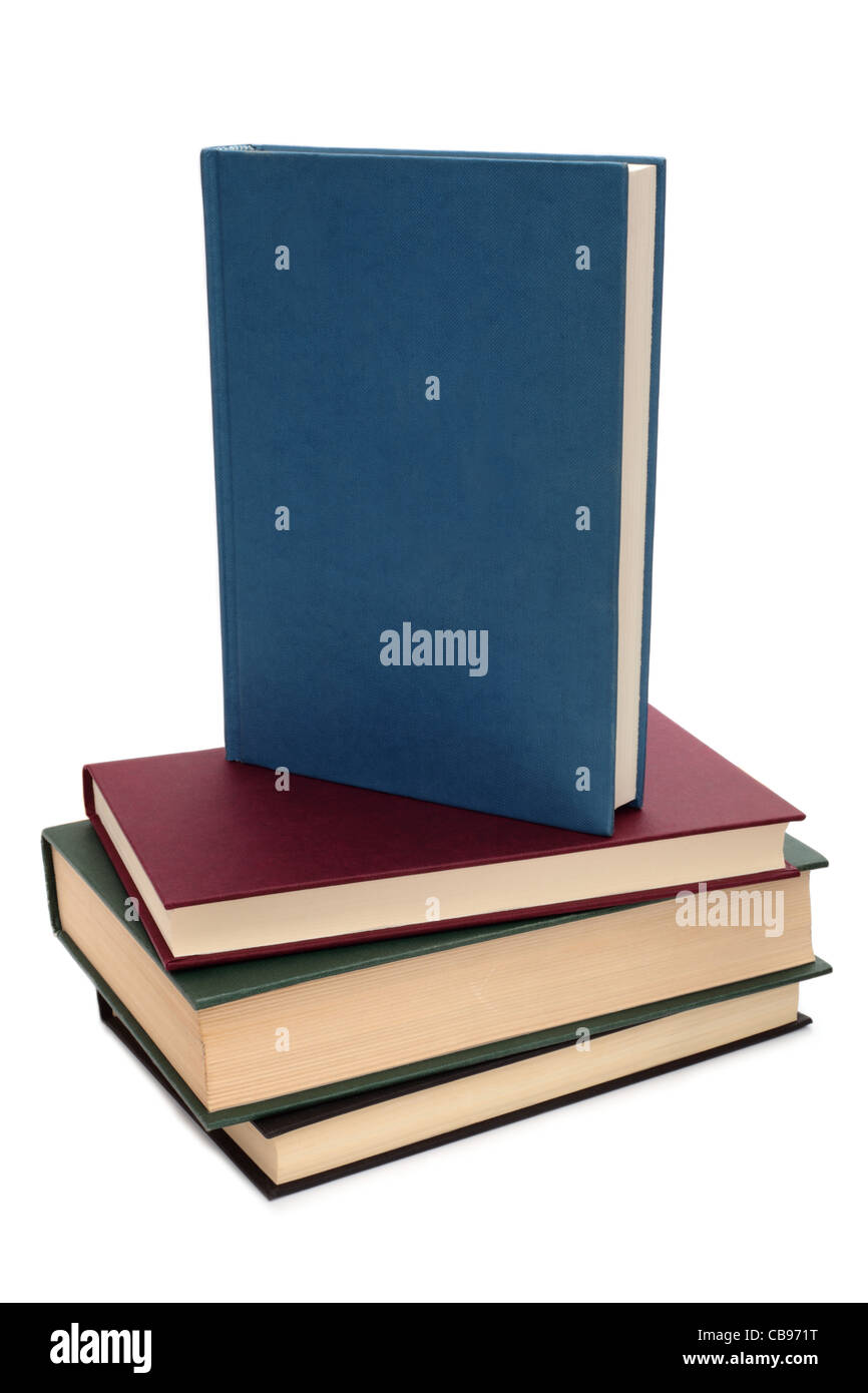 A stack of books with one book on the top showing a blank blue cover ...