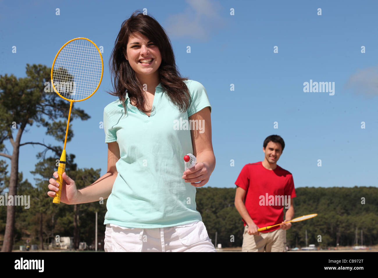 A couple playing badminton Stock Photo - Alamy