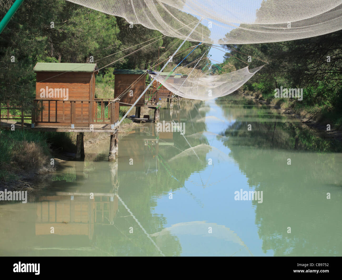 Netting and wooden cabins for fishing purposes on a ditch, Cervia ...