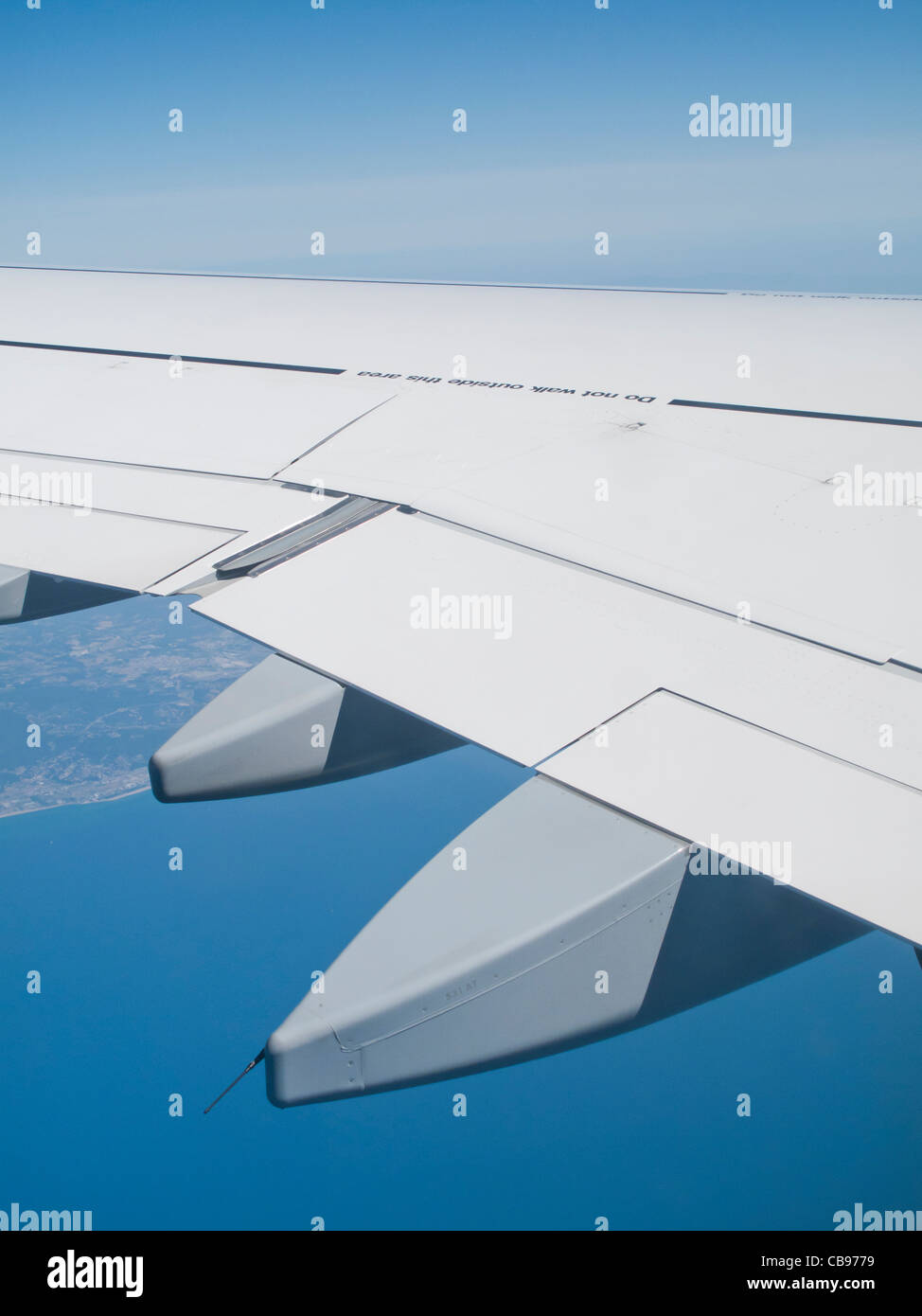 Inflight view of the left wing of a commerical airplane over the ...