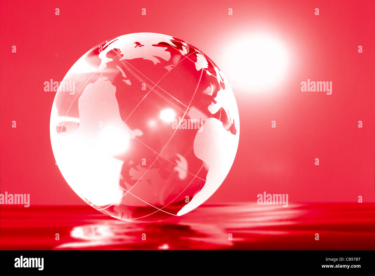 Glass globe with bright highlights on a red background Stock Photo - Alamy