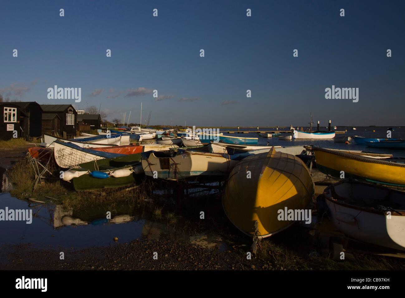 Lots of small boats moored at Orford Quay in Suffolk, England Stock ...