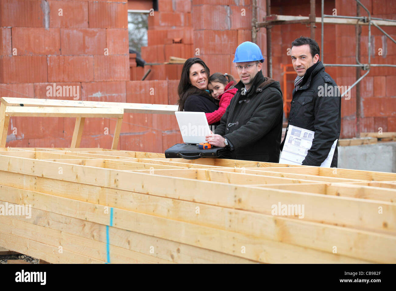 Architect showing plans to customer Stock Photo - Alamy