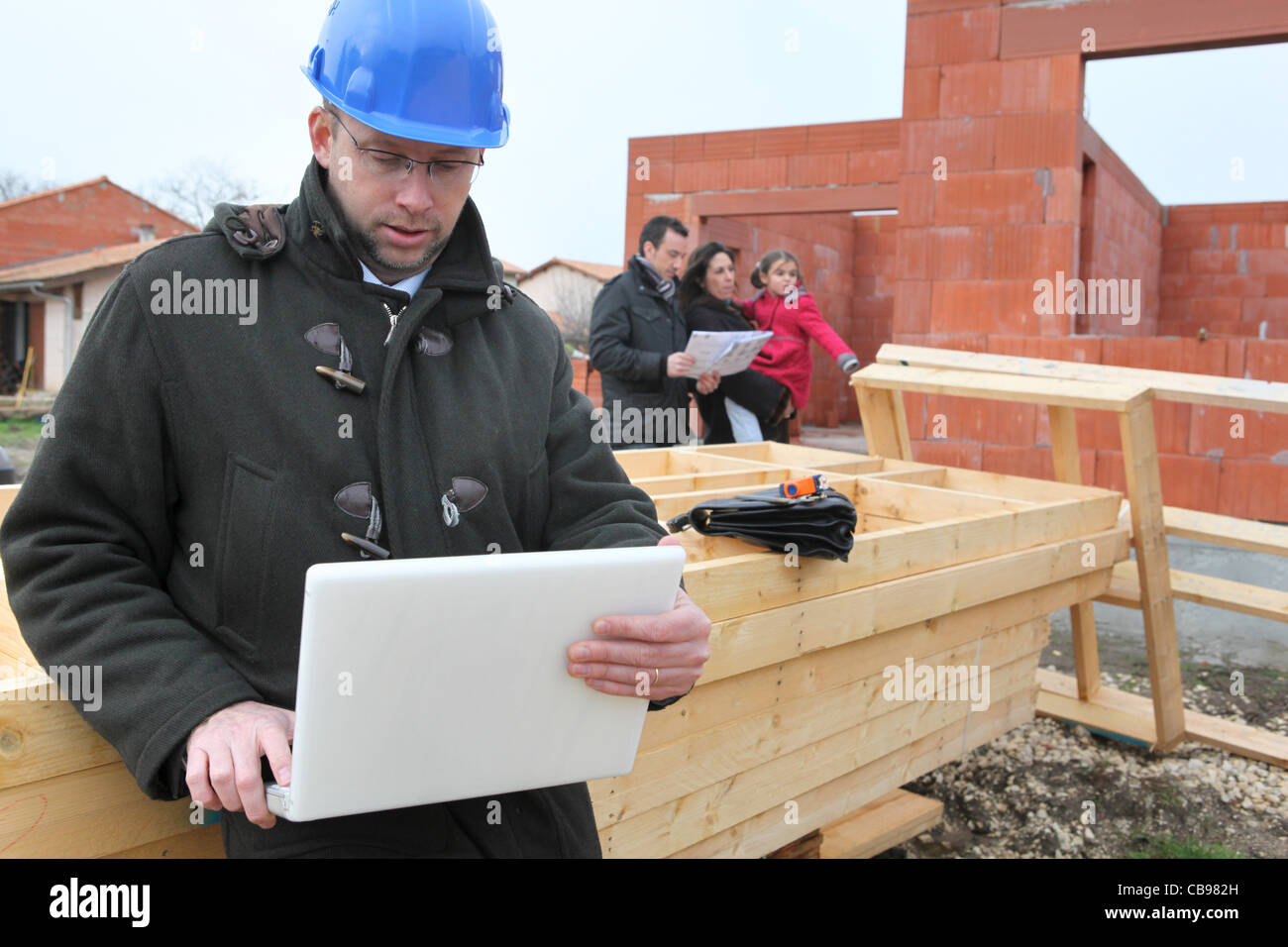 Architect on site with clients Stock Photo - Alamy