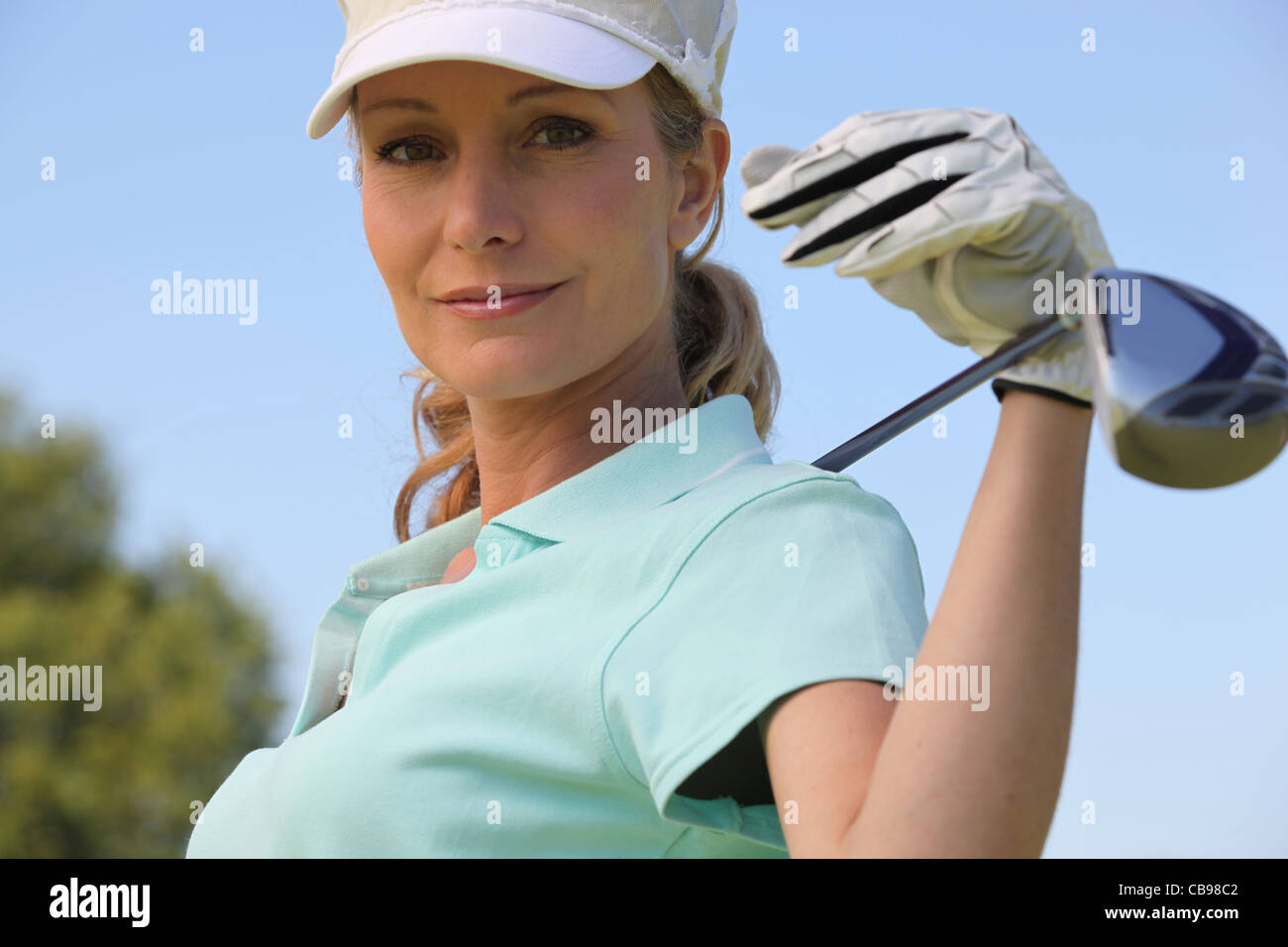Female golf player Stock Photo - Alamy