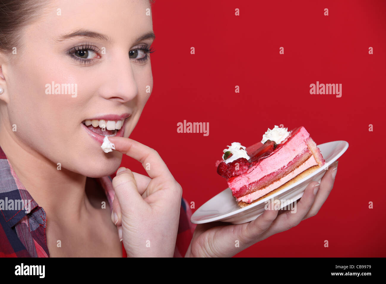woman eating cake Stock Photo - Alamy