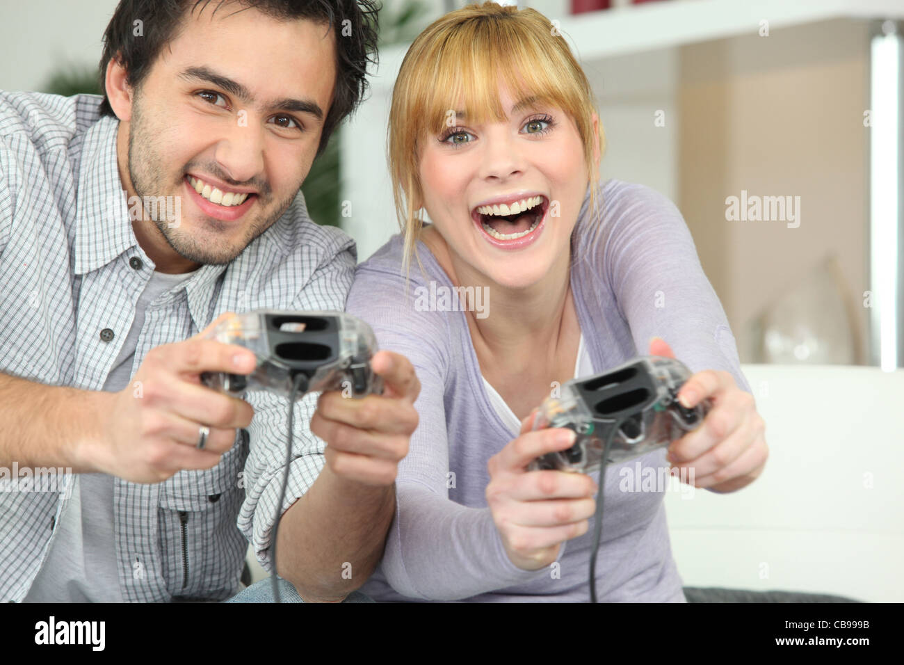 Couple playing video games Stock Photo - Alamy