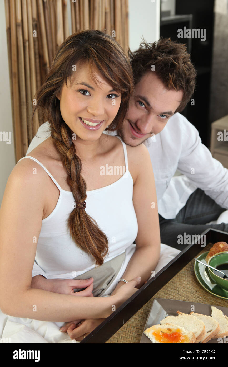 Couple eating breakfast Stock Photo - Alamy