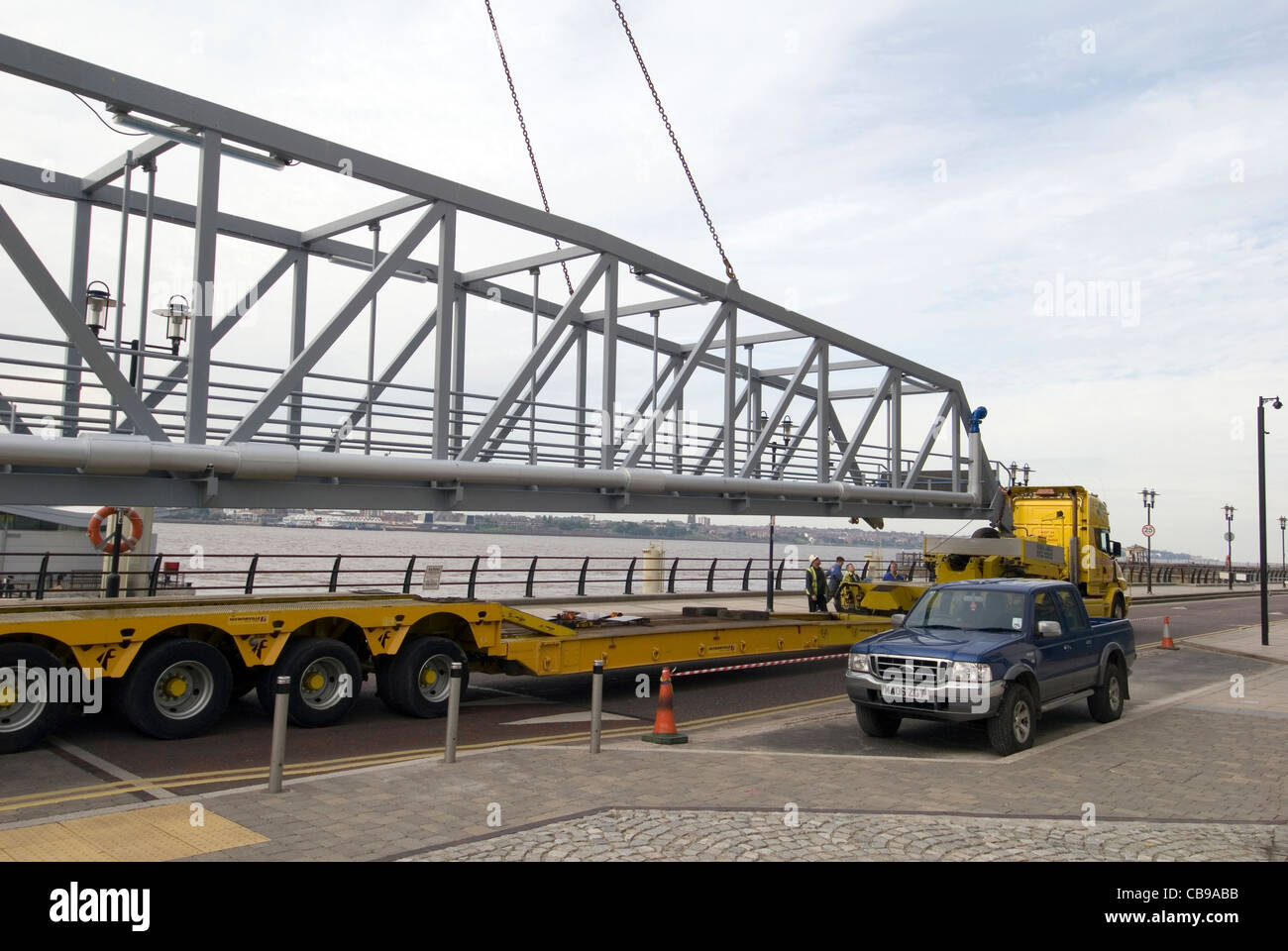 Pontoon bridge being lifted onto a low loader heavy goods vehicle ...