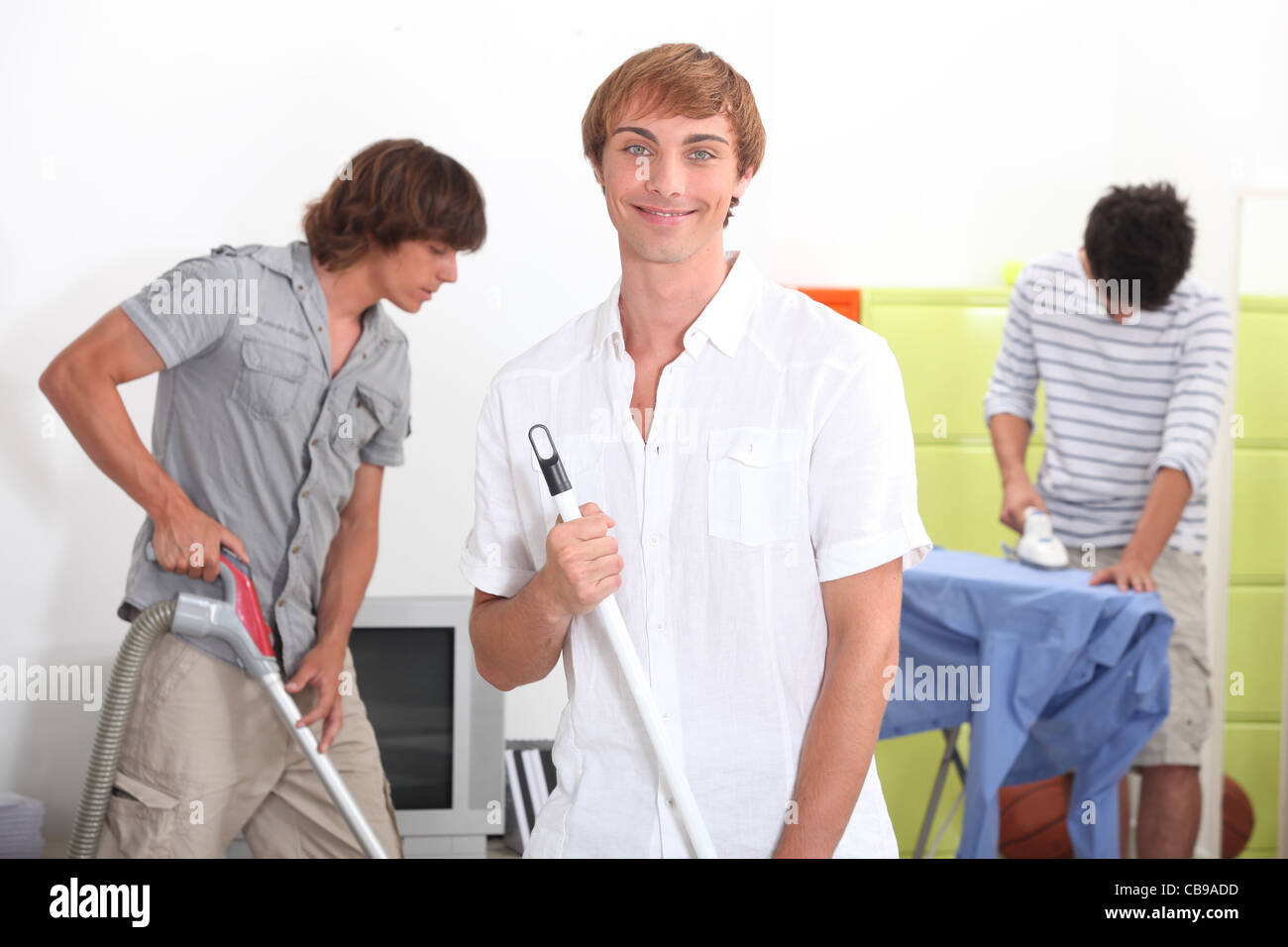 Young men cleaning Stock Photo - Alamy