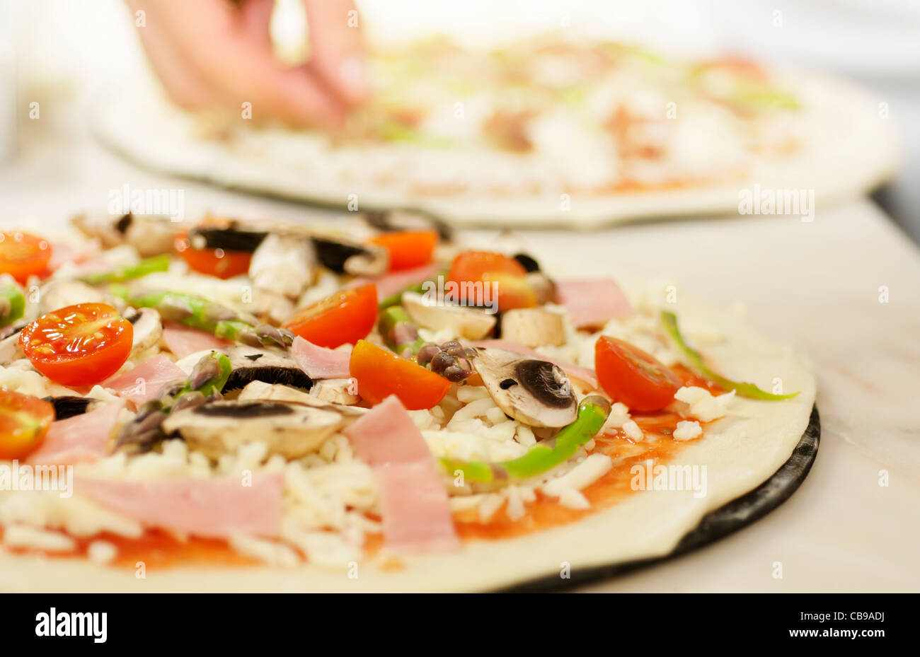 Making a pizza Stock Photo - Alamy