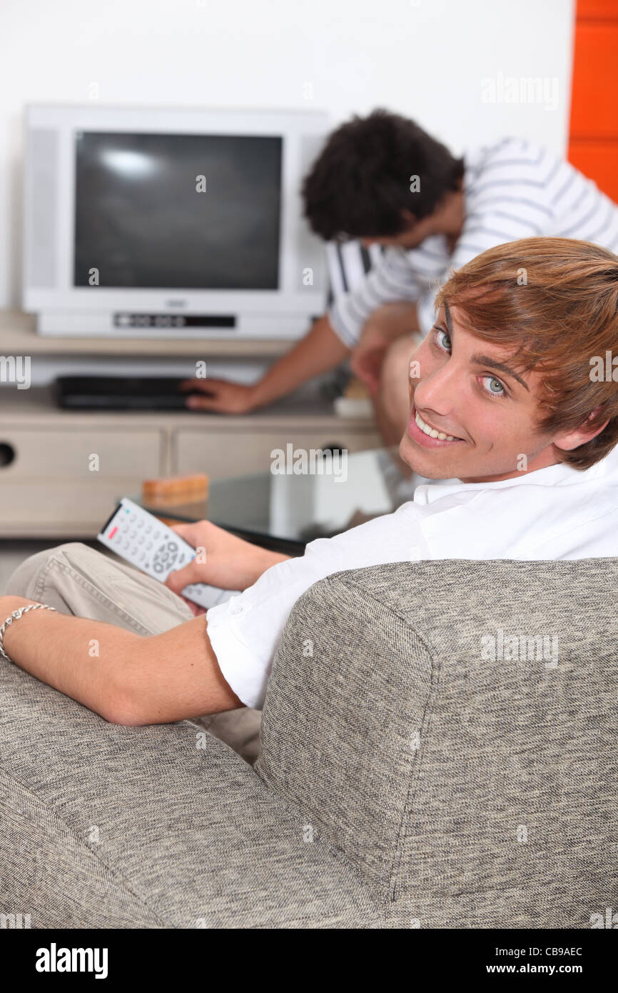 Turning on the TV Stock Photo - Alamy