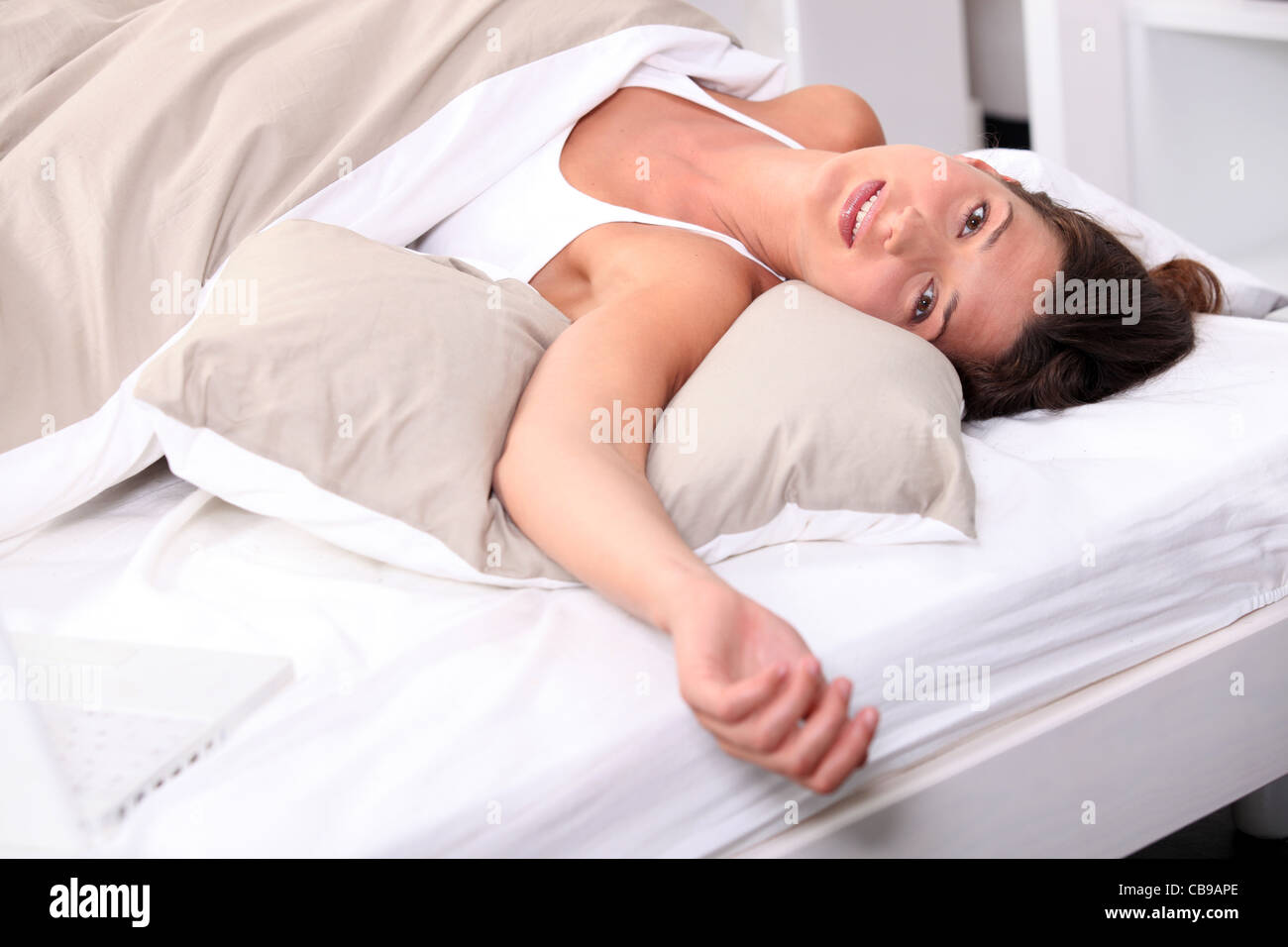Woman sprawled in bed hi-res stock photography and images - Alamy