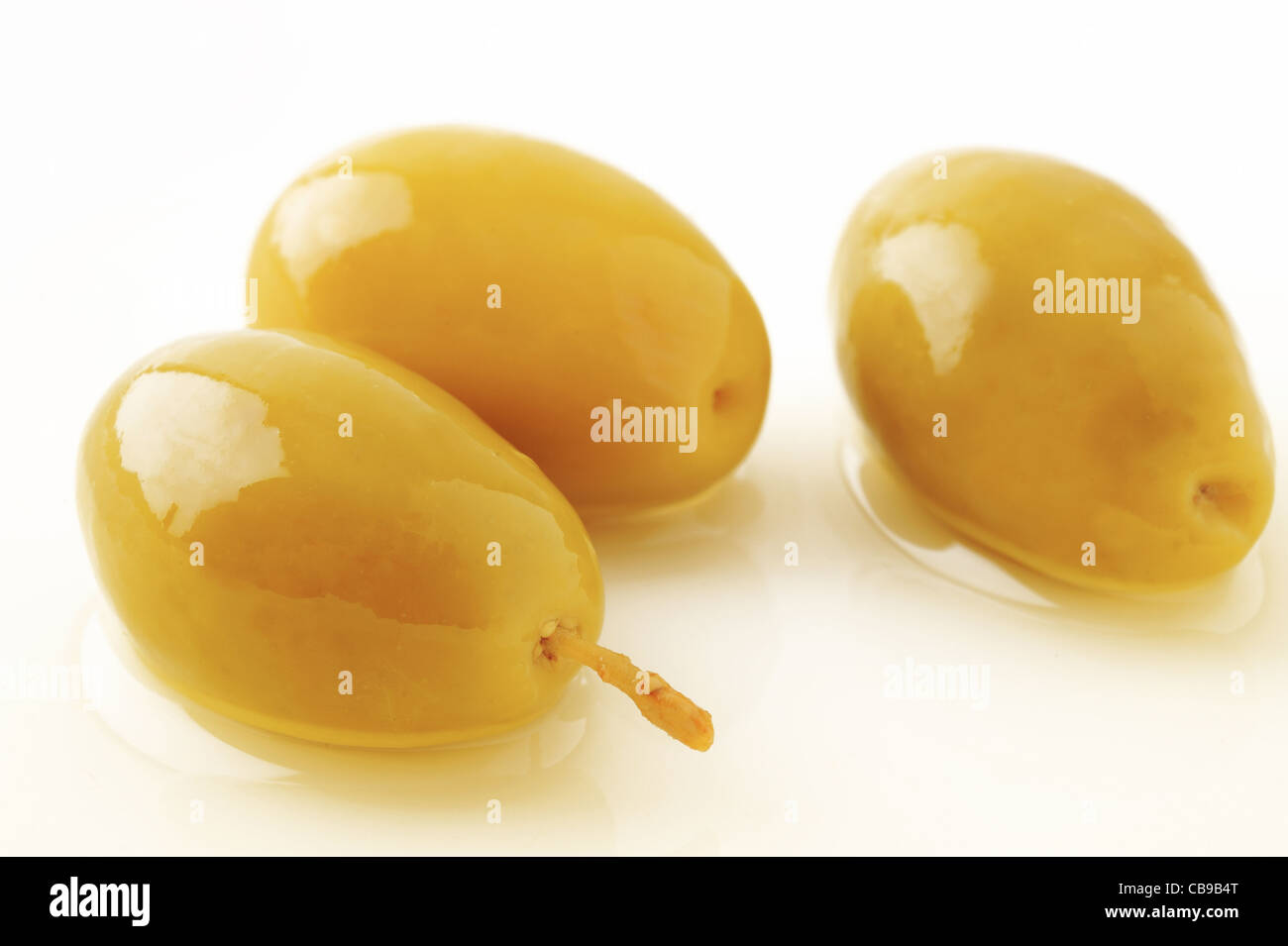 Three of pickled olives Stock Photo - Alamy