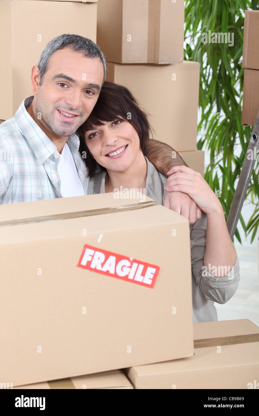 Couple moving house Stock Photo - Alamy