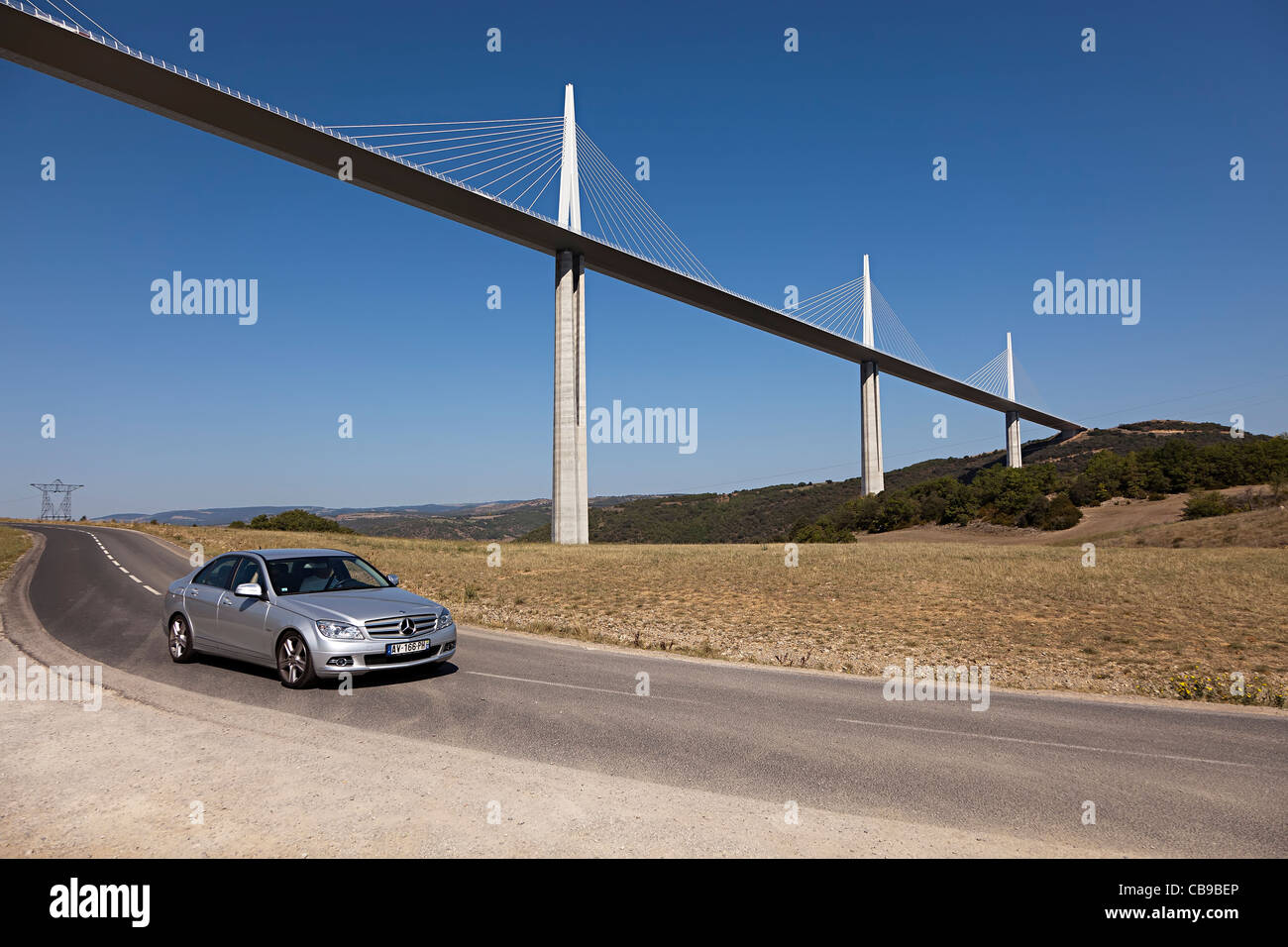 Car driving under suspension bridge Milau France Stock Photo - Alamy